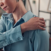 Creative, woman and massage neck pain in office from bad posture ...
