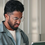 Confused, reading and tablet with man in home for streaming glitch ...