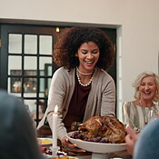 Thanksgiving, turkey and celebration with family in dining room for ...