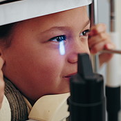 Vision, eye test and child with tonometer in clinic to measure IOP ...