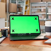 Green screen, empty and laptop on desk for logistics, shipping and ...