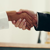 Handshake, welcome and meeting with people in hotel for hospitality ...
