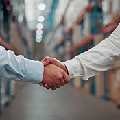Shaking hands, logistics and people in warehouse for deal, agreement or ...