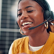 Headset, smile and support with black woman in solar energy call center ...