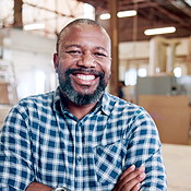 Face, smile and man with arms crossed, carpentry and furniture industry ...